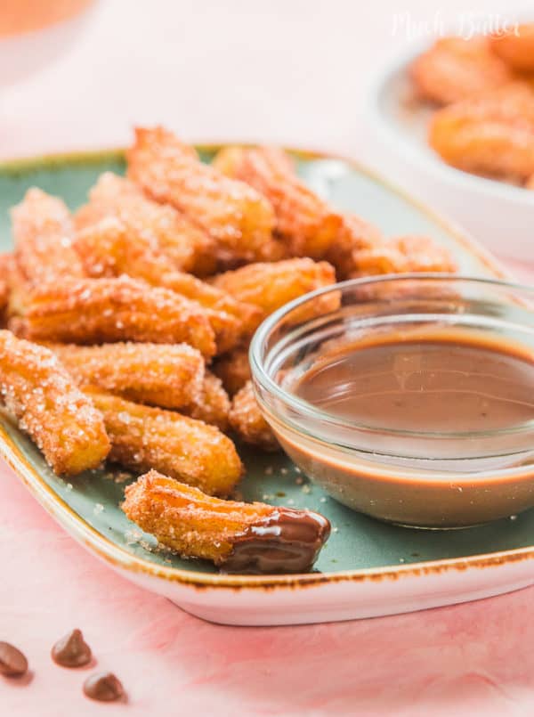 Cinnamon Churro Bites with Chocolate Sauce - Much Butter